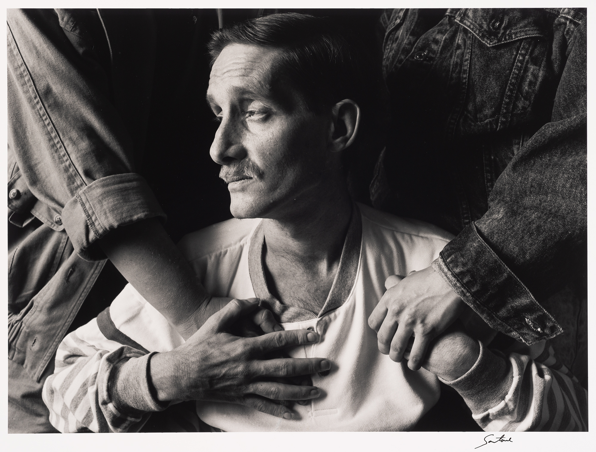 View of Bobby, Head and Shoulders, Holding Hands with Two People Who ...